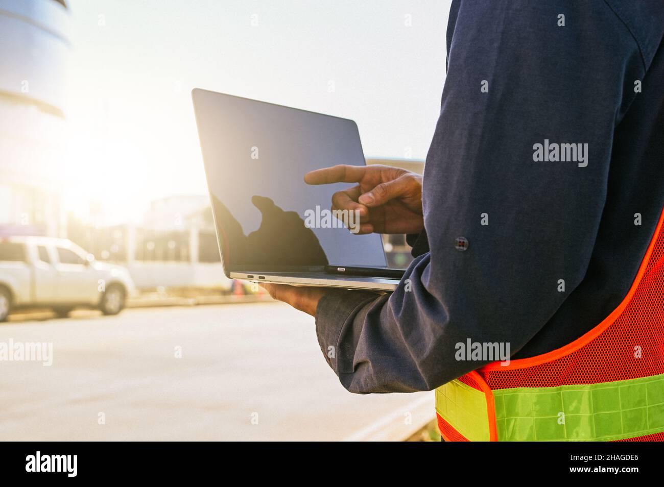 Engineer holding laptop computer send data work internet technology ...
