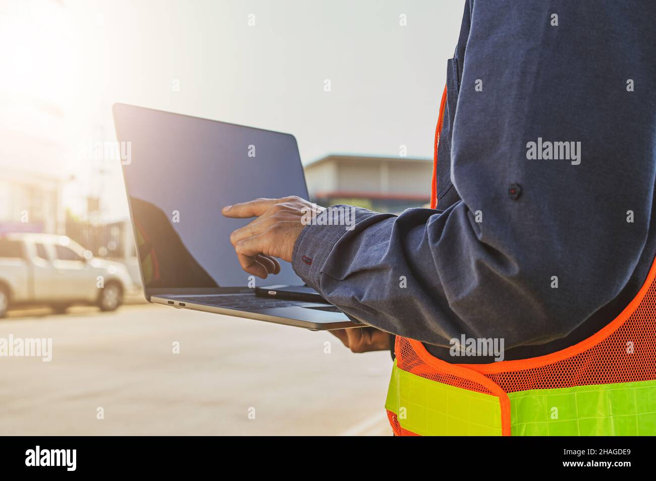 Engineer holding laptop computer send data work internet technology ...