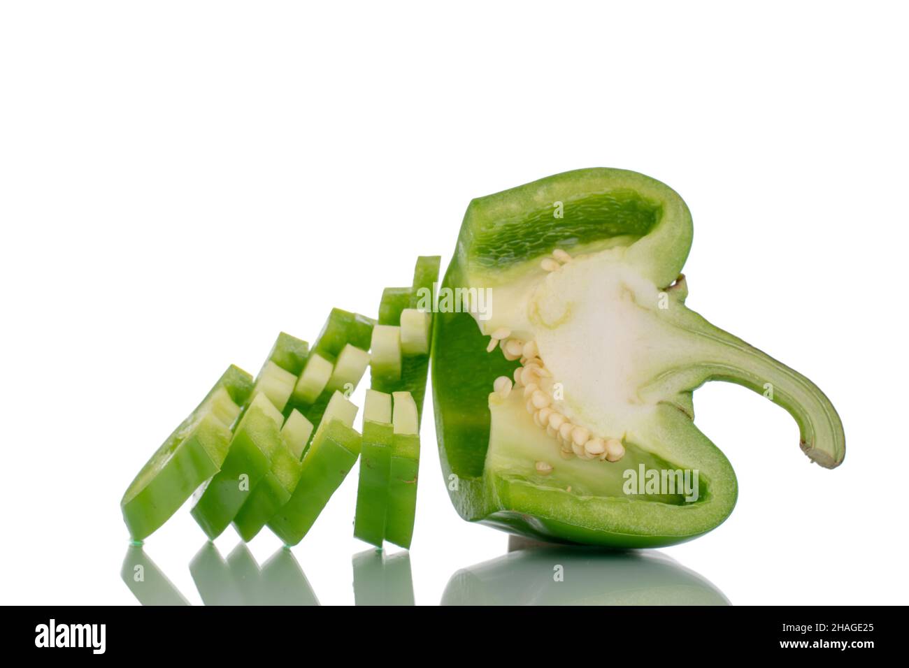 One half of a juicy sweet green pepper cut into slices, close-up ...