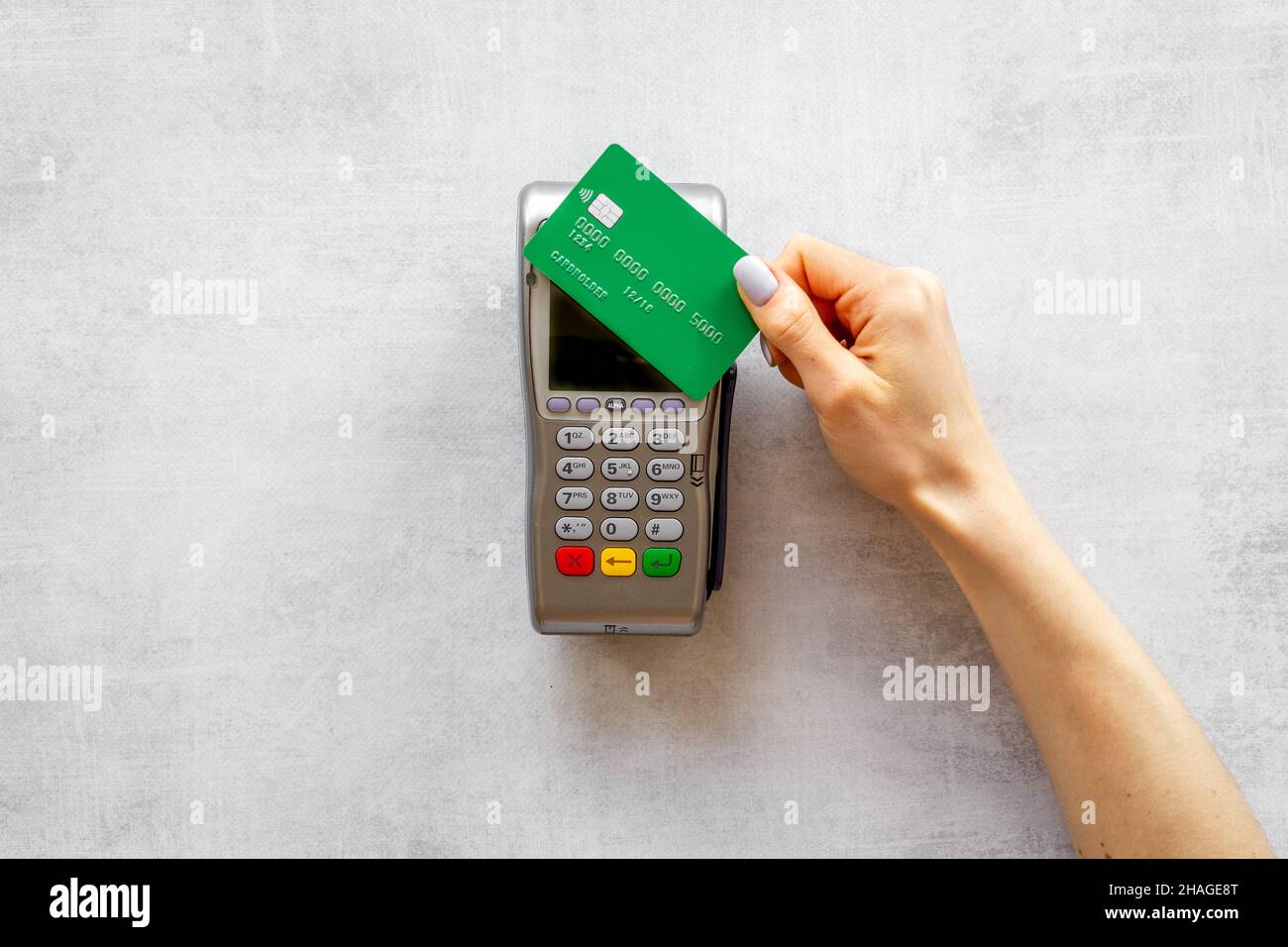 Hand paying by card with pos payment terminal. Payment transactions ...