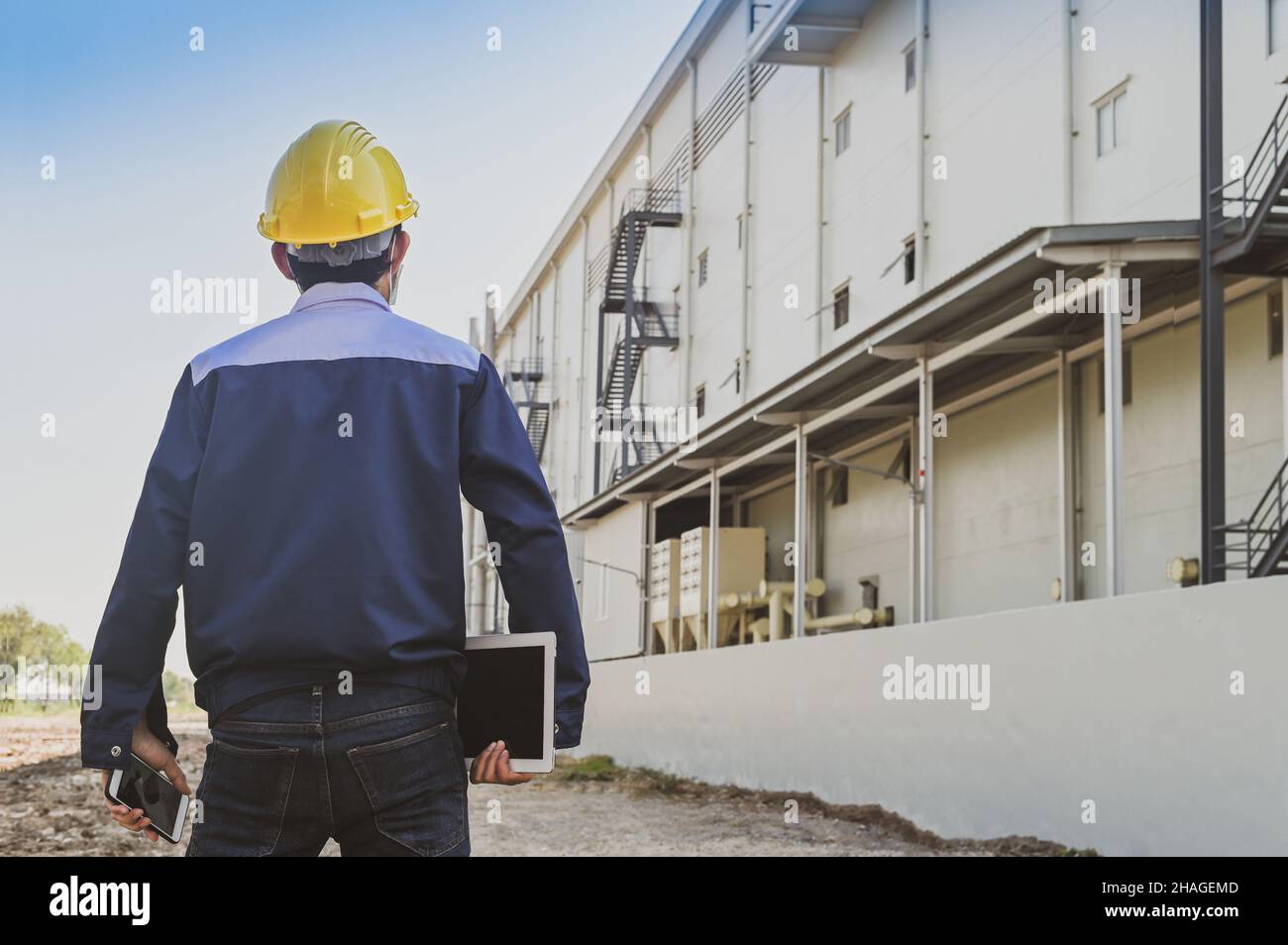 Engineer standing factory plant background , Technician workplace ...