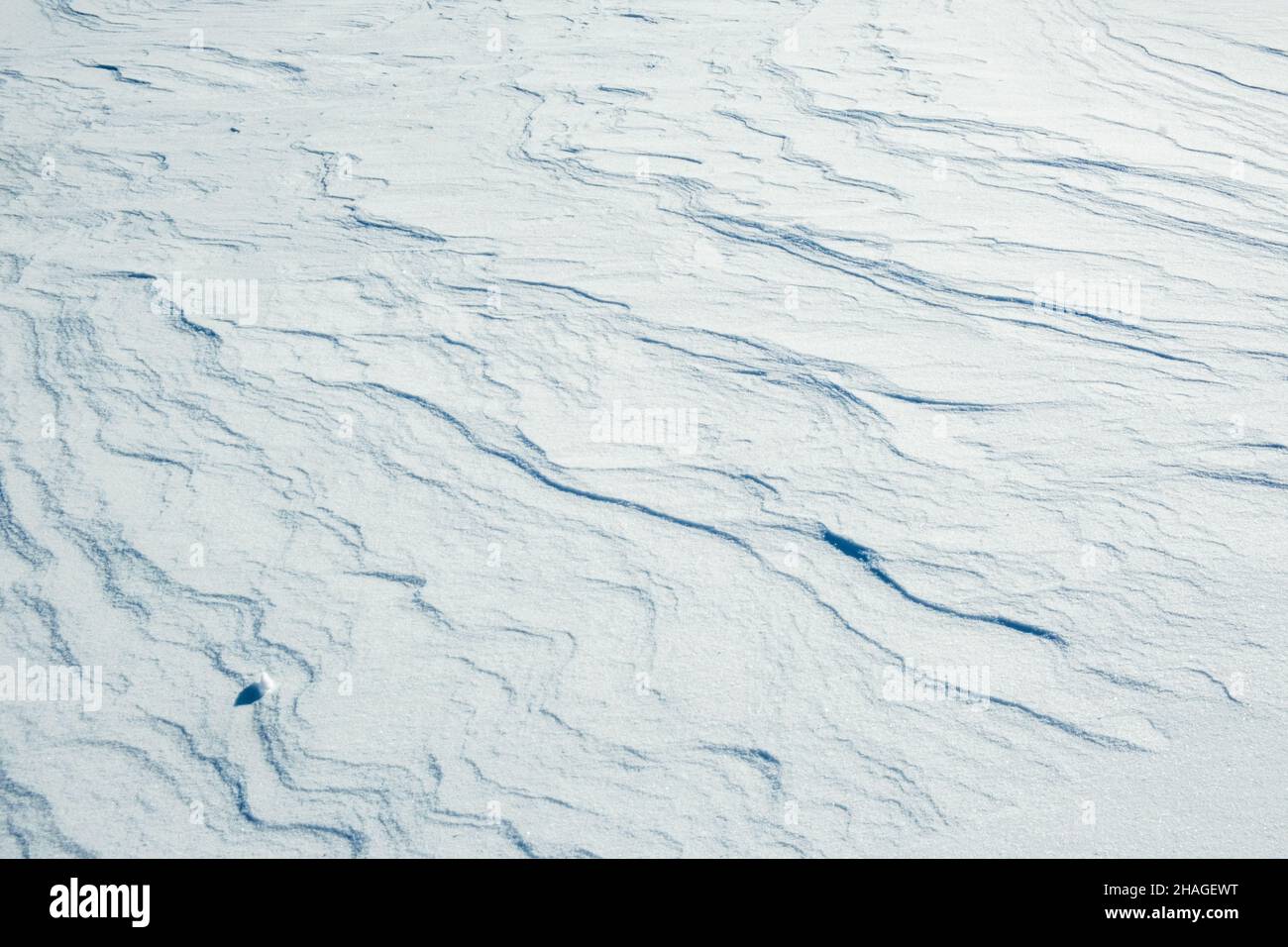 Snow texture with snow waves. Winter nature background Stock Photo - Alamy