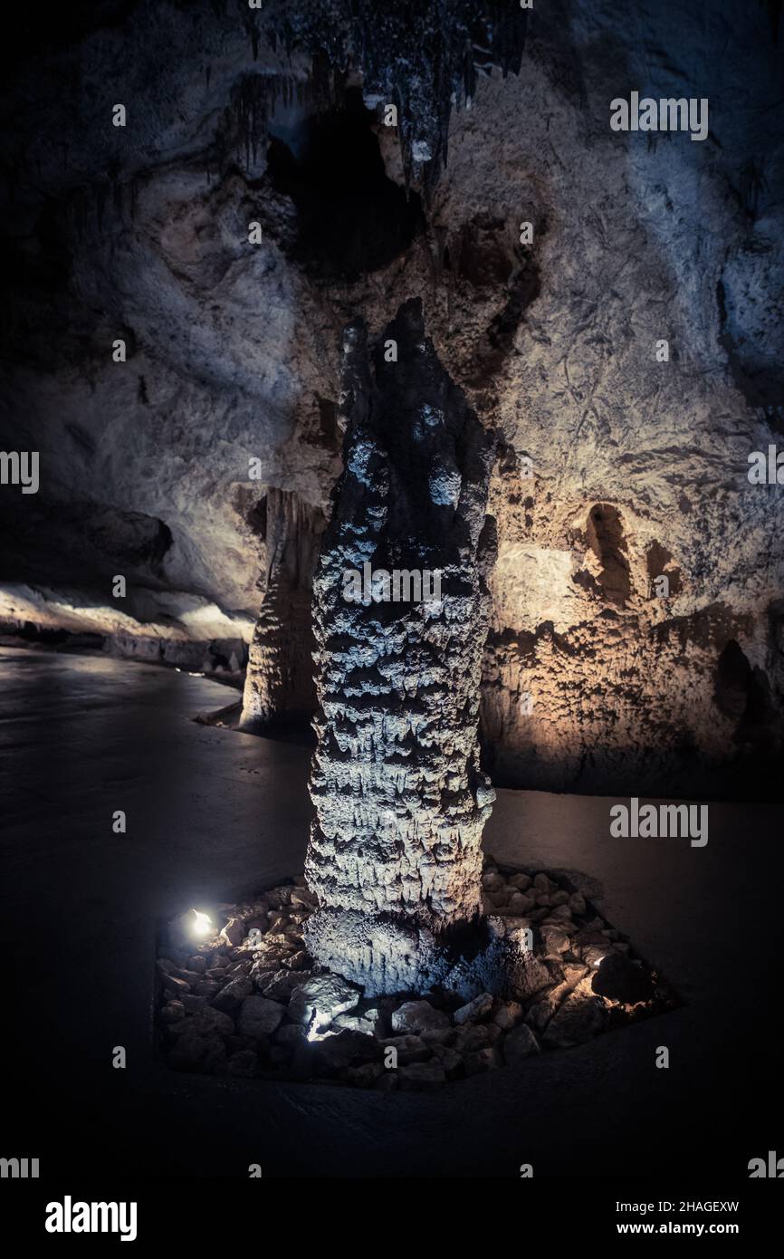 Image of a giant stalagmite in a an underground cave Stock Photo - Alamy