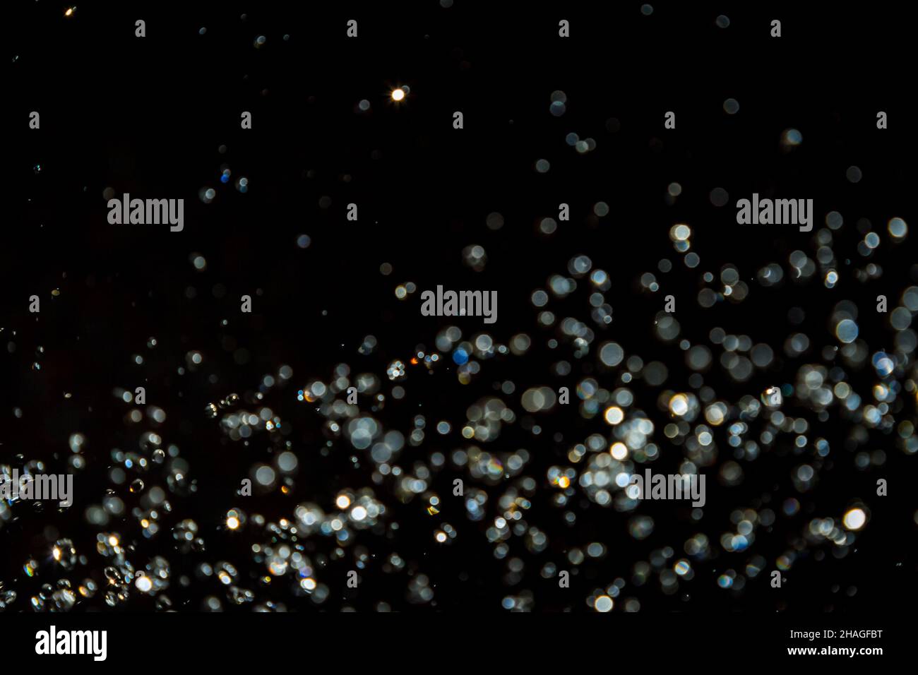 Abstract bokeh texture on black background Stock Photo - Alamy