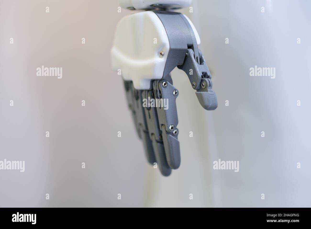 Robotic hand with fingers on a white background Stock Photo - Alamy