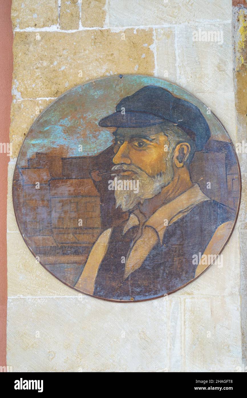 Greek fisherman poster on a crumbling wall in Chania, Crete, Greece ...