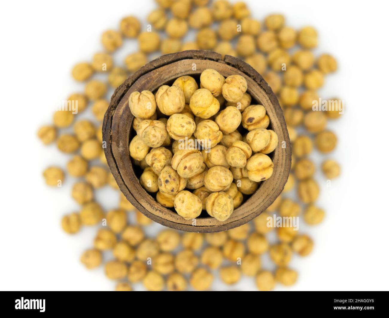 Roasted yellow chickpeas in a wooden bowl, Chickpeas in top close-up ...