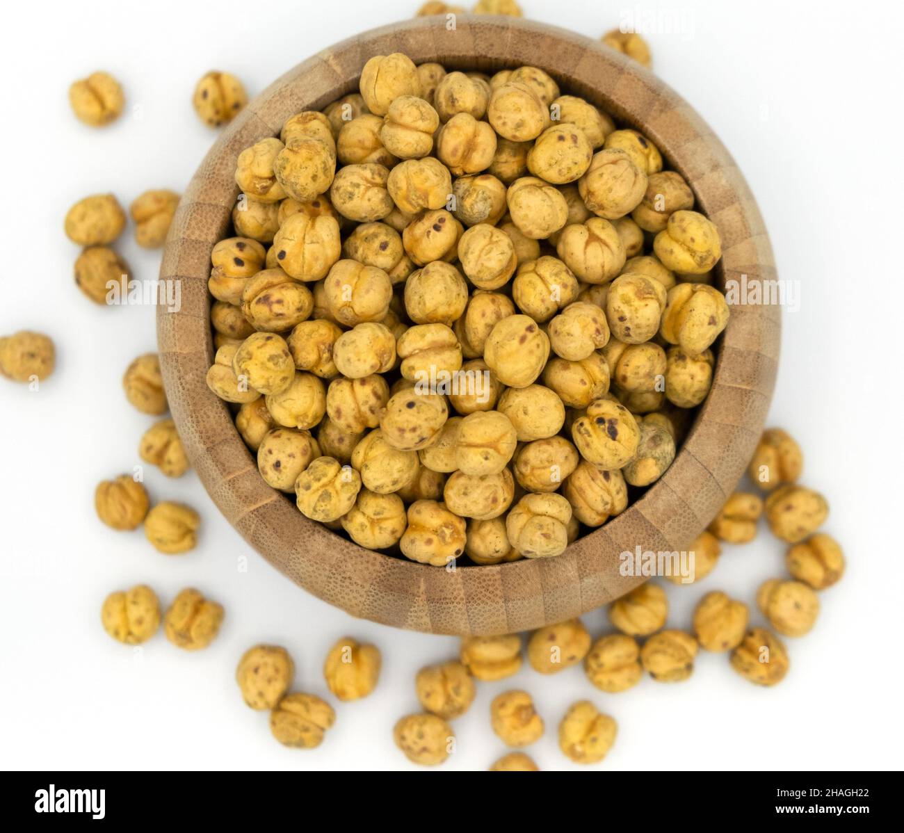 Roasted yellow chickpeas in a wooden bowl, Chickpeas in top close-up ...
