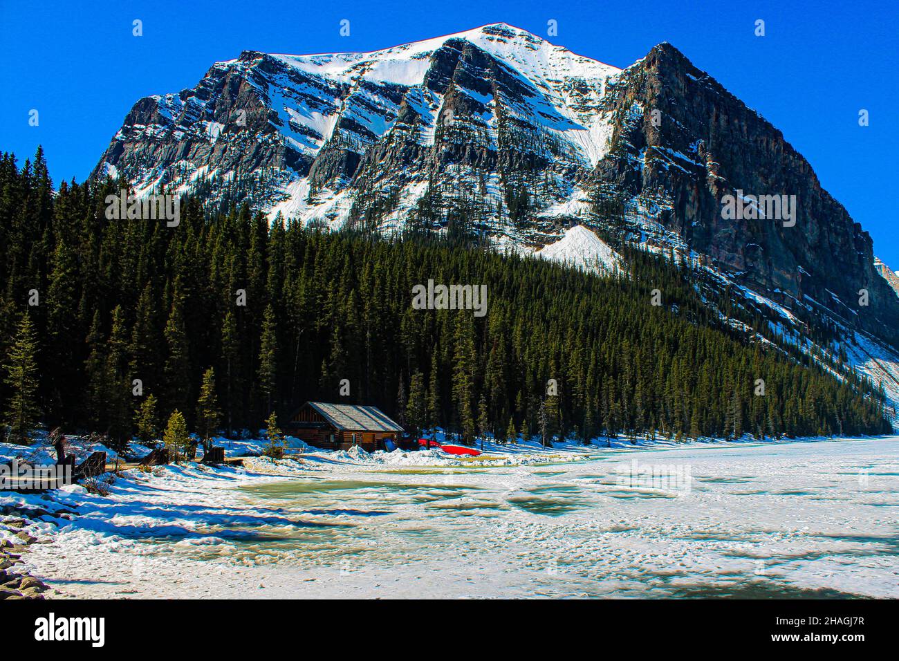 Frozen Lake Louise with mountains range background in Banff Alberta ...