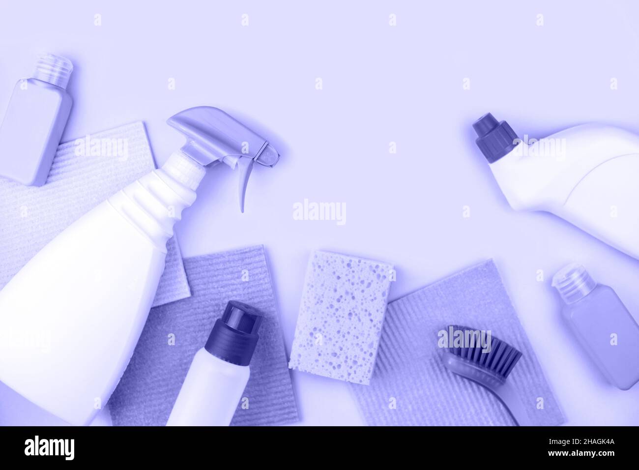 House cleaning products are on purple background. Cleaning concept ...