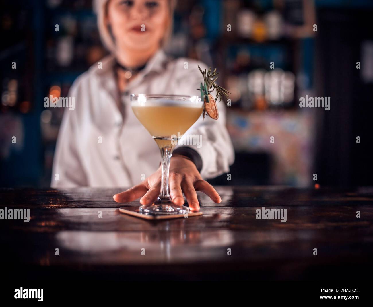 Young barmaid demonstrates his professional skills on the bar Stock ...