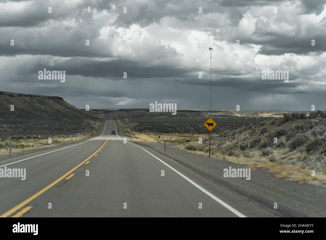 U.S. 95 asphalt highway in Eastern Oregon under a gray cloudy sky on a ...