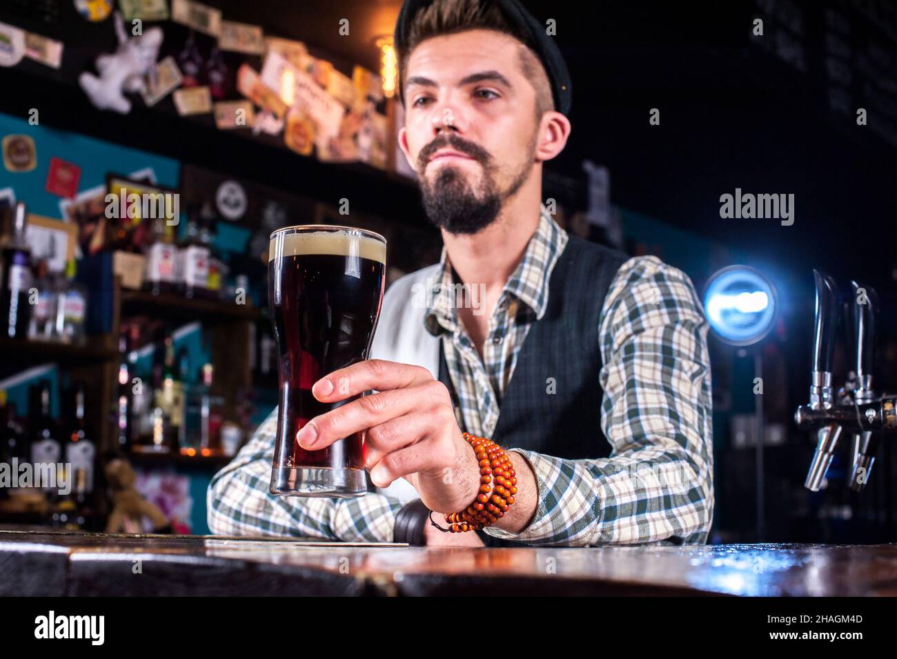 Barman mixes a cocktail at the saloon Stock Photo - Alamy