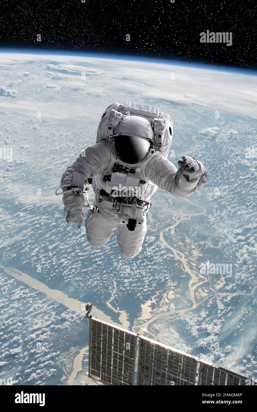 Astronaut in outer open space over the planet Earth.Stars provide ...