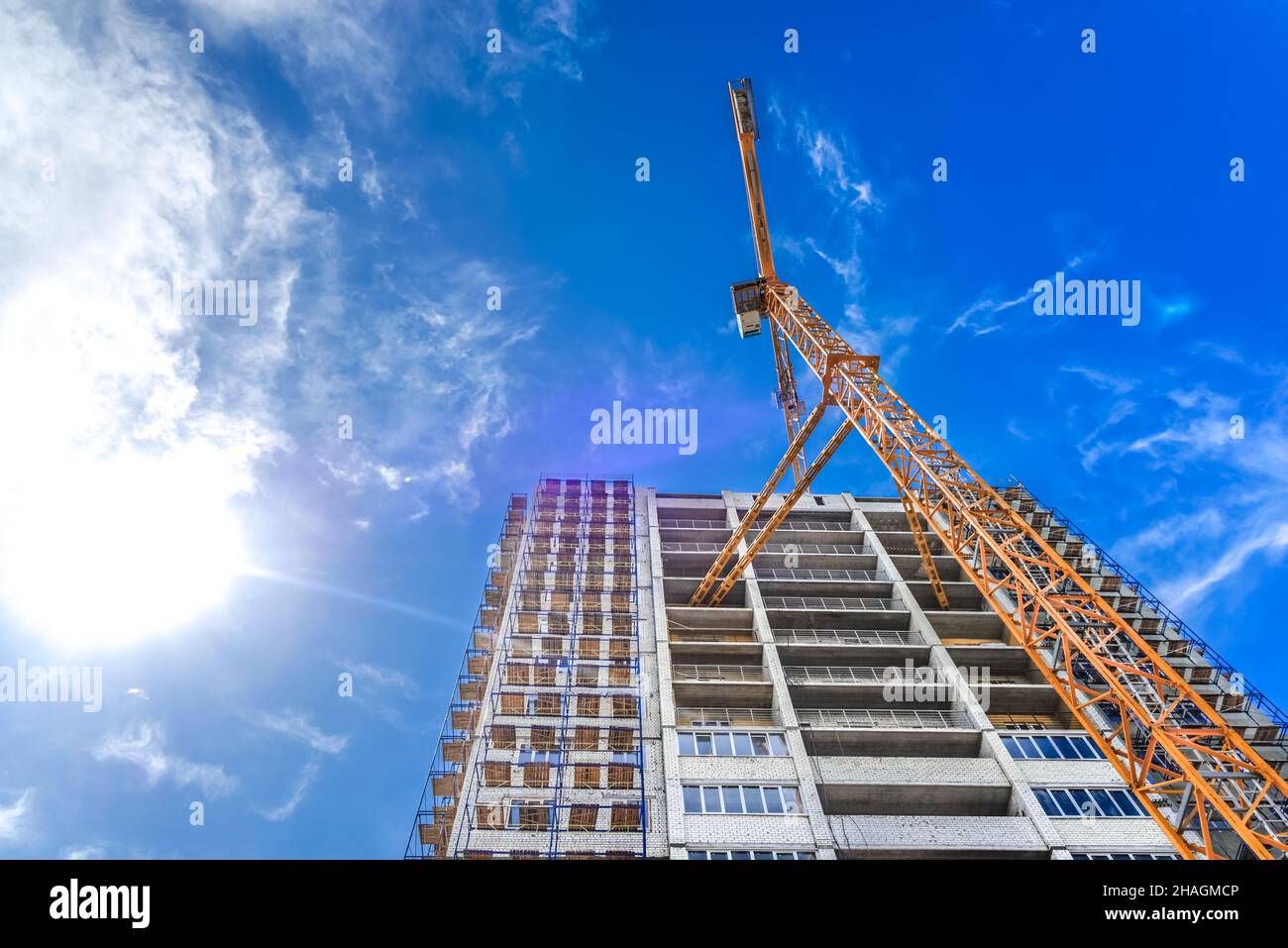 Multistorey housing and high-rise crane Stock Photo - Alamy