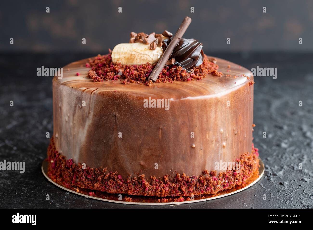 Banana and chocolate cake on a dark background. Horizontal view. Close ...