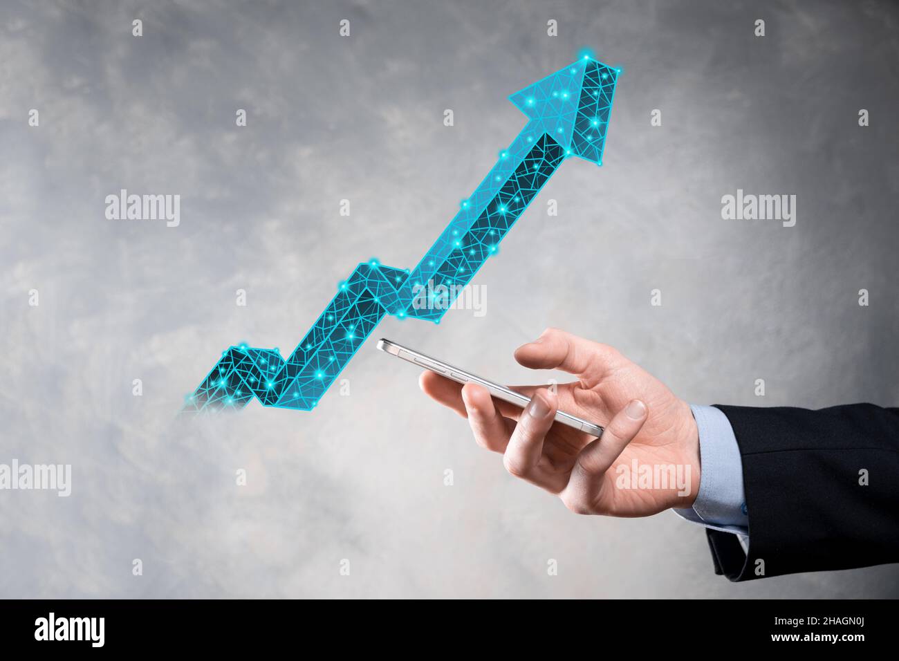 Businessman hold graph, arrow of positive growth icon.pointing at ...