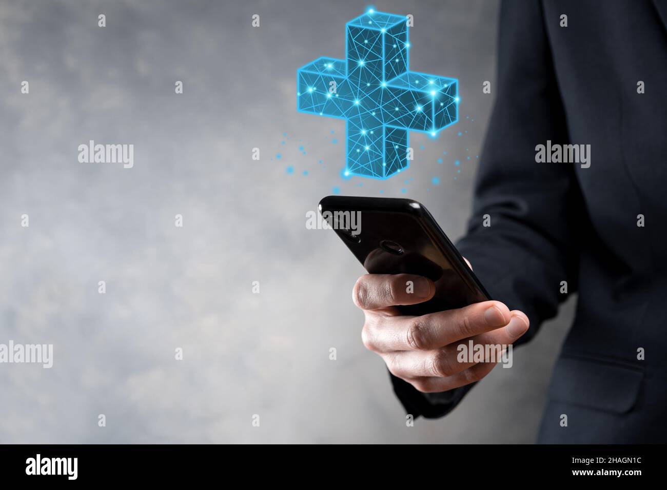 Businessman hand holding 3D plus low polygonal icon.Plus sign virtual ...