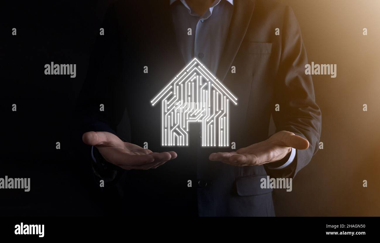 Businessman hold house icon.Smart home controlled, intelligent house ...