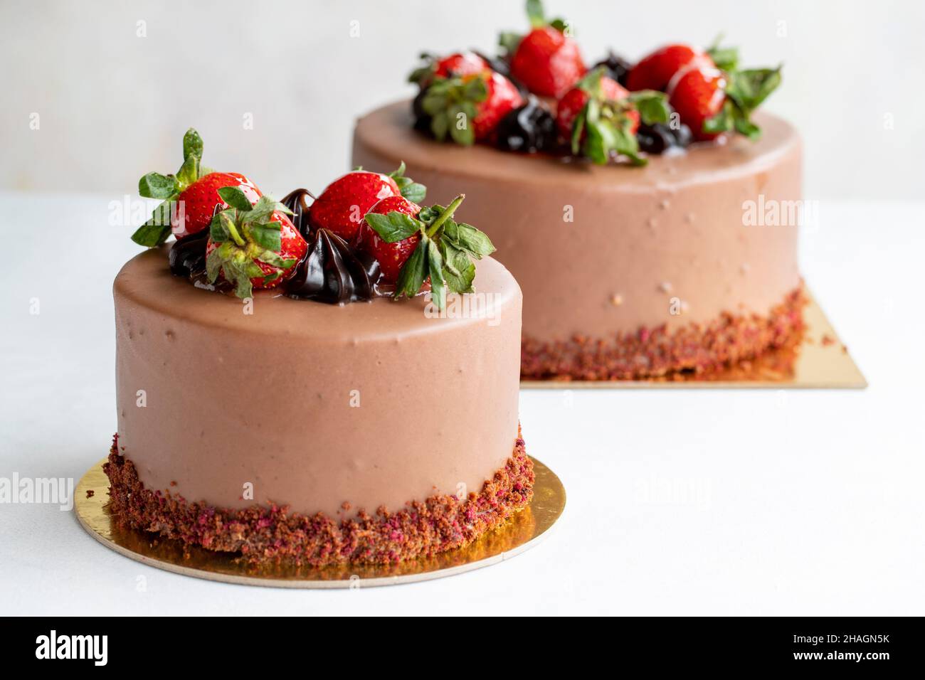 Strawberry and chocolate cake on a white background. Horizontal view ...