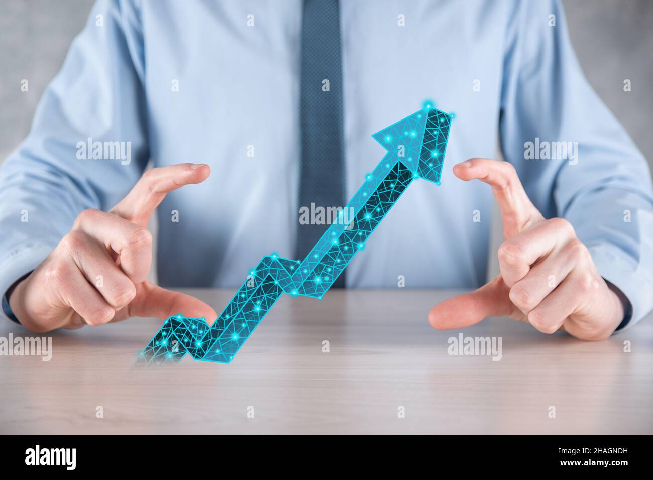 Businessman hold graph, arrow of positive growth icon.pointing at ...