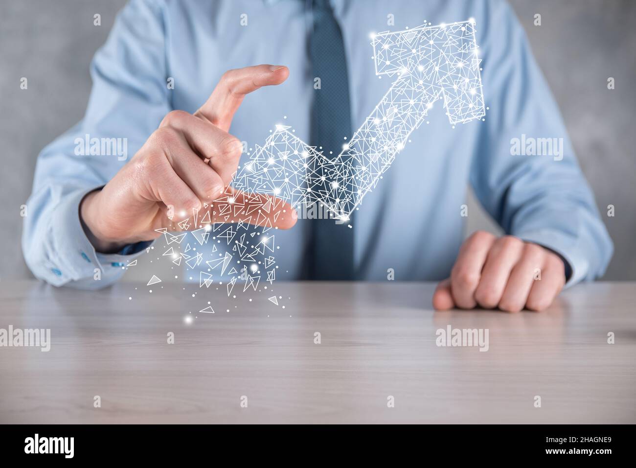 Businessman hold graph, arrow of positive growth icon.pointing at ...