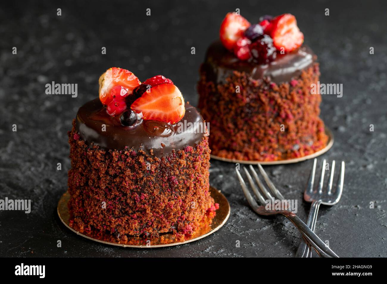 Forest fruit cake on a dark background. Horizontal view. Close-up ...