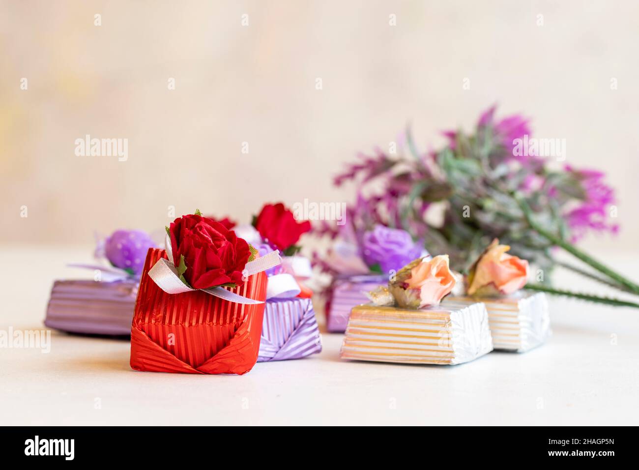 Packed chocolates on a white background. Horizontal view. Close-up ...