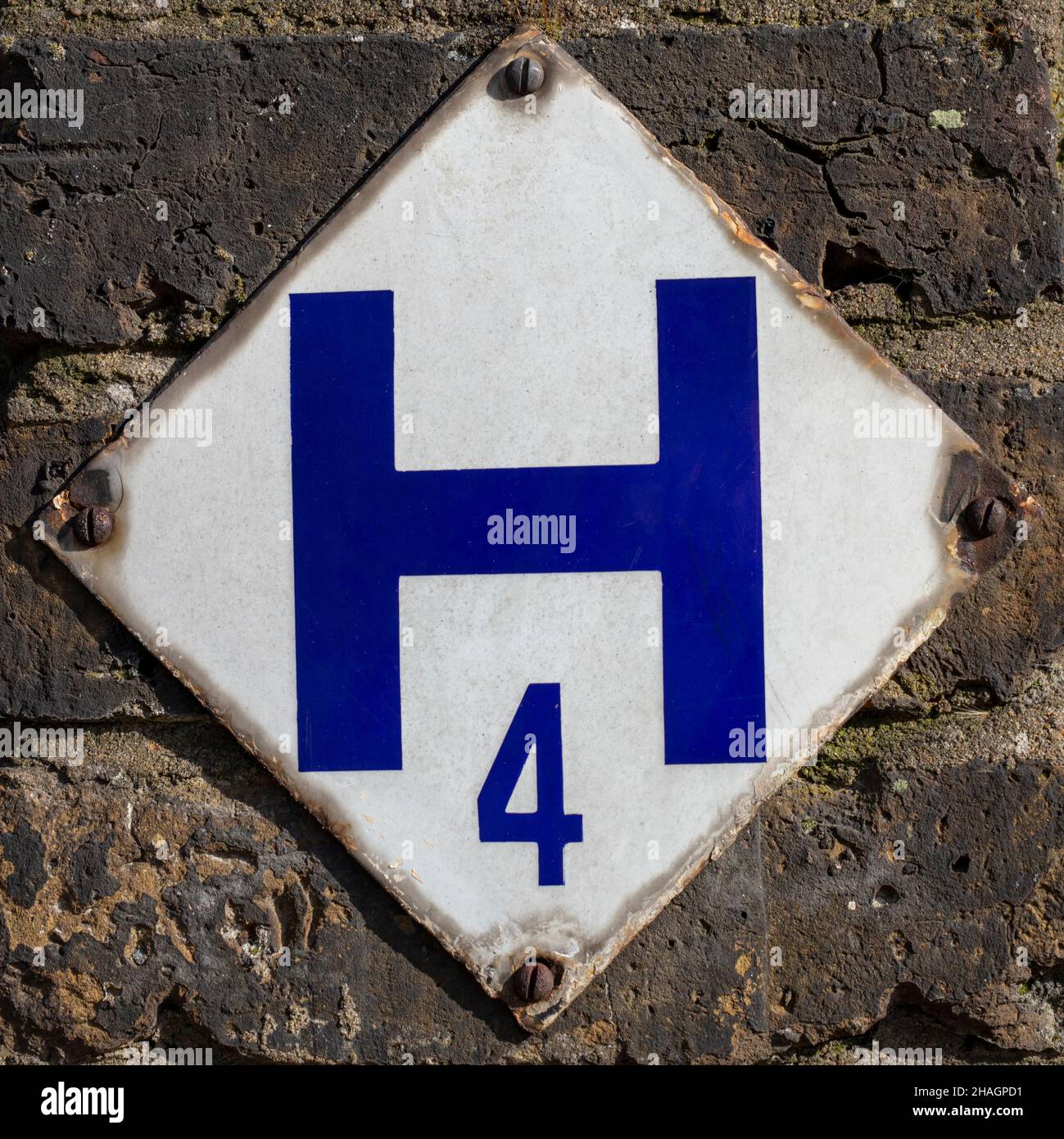 Sign on wall in London street indicating distance of fire hydrant from ...