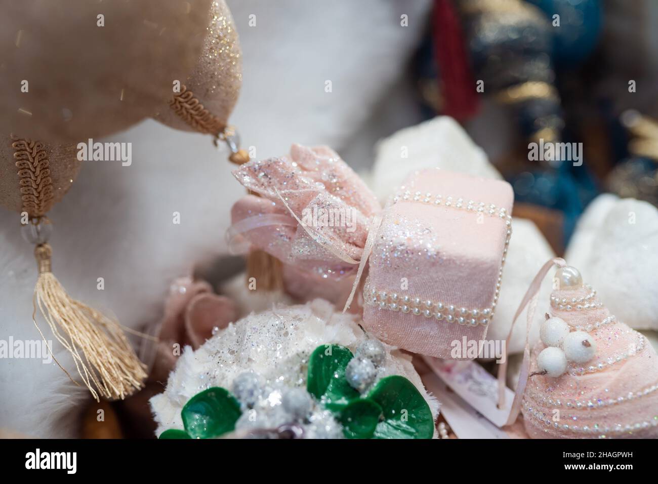 Different object toy gifts hanging from a decorated Christmas tree ...