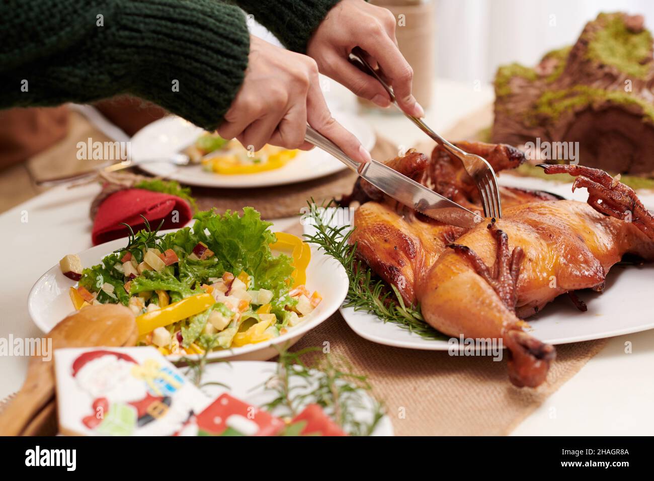 Close-up image of woman cutting fried chicken for every guest at ...