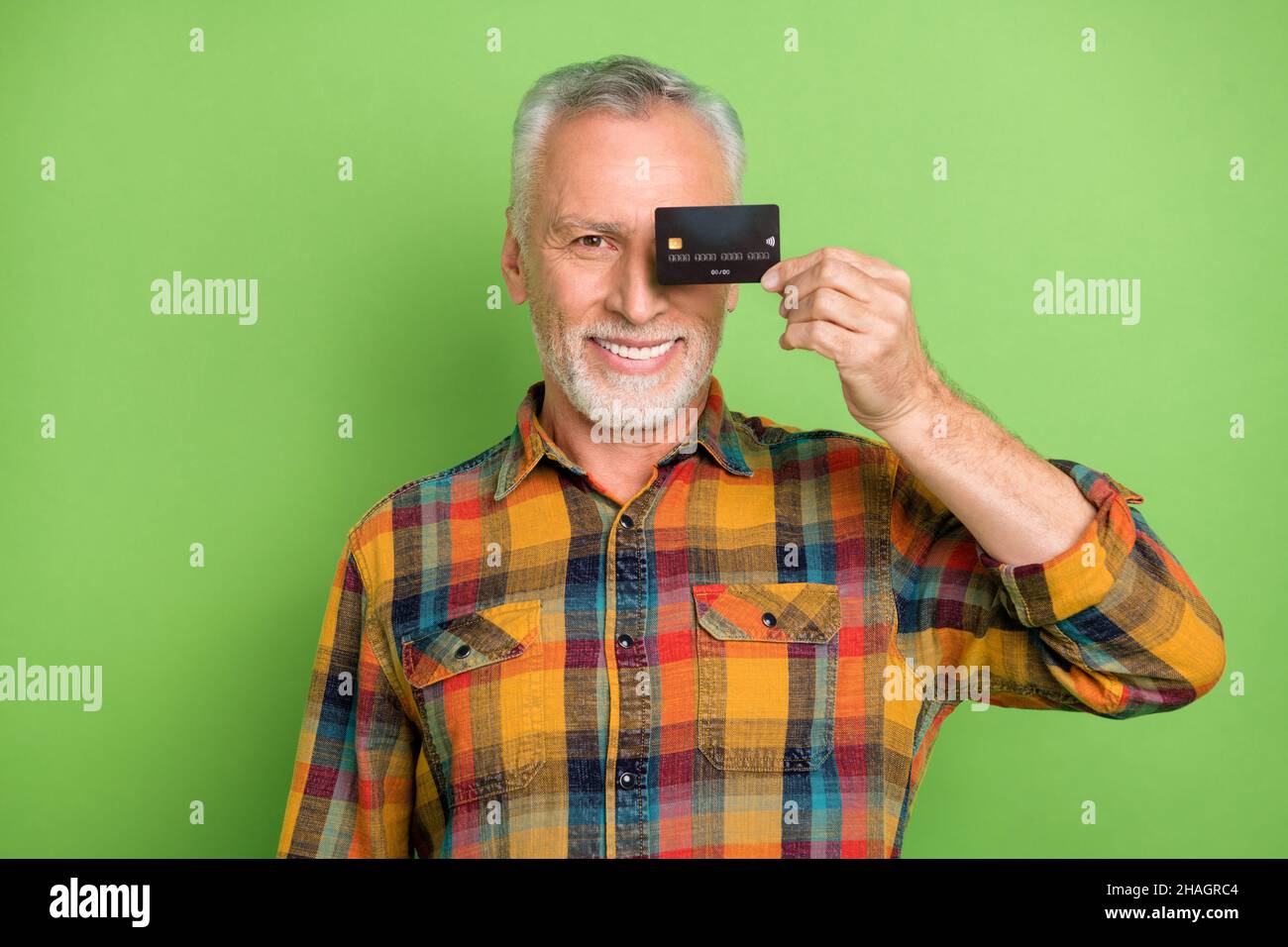 Photo of funky elder beard man hold card wear plaid shirt isolated on ...