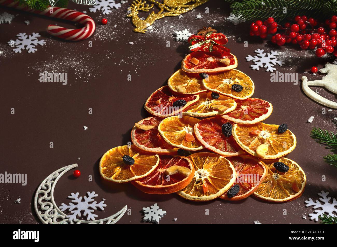 Festive fir tree from dried fruits. Christmas or New Year festive flat ...