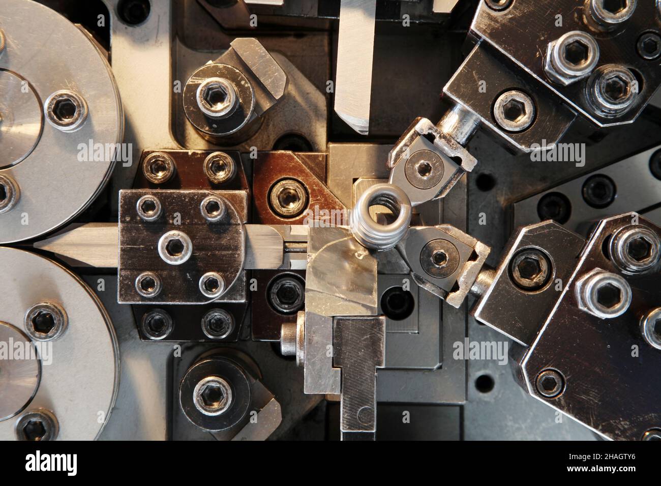 CNC spring making machine. Industrial machine Stock Photo - Alamy