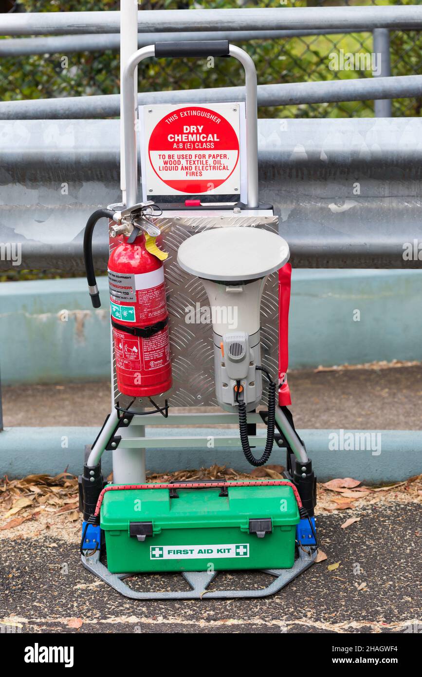A trolley with a first aid kit, a fire extinguisher and a loudspeaker ...