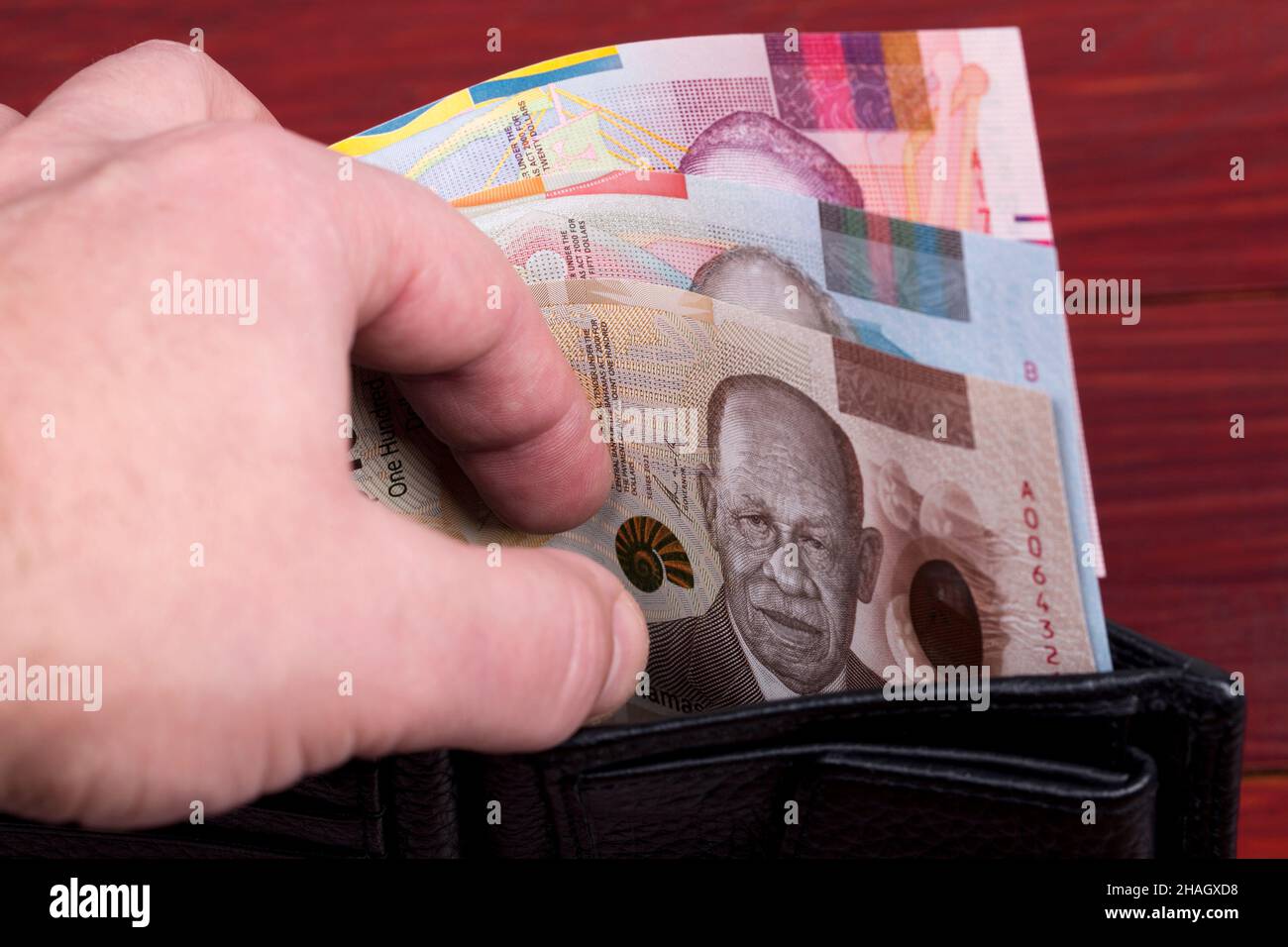 Currency of The Bahamas - dollar in the black wallet Stock Photo - Alamy