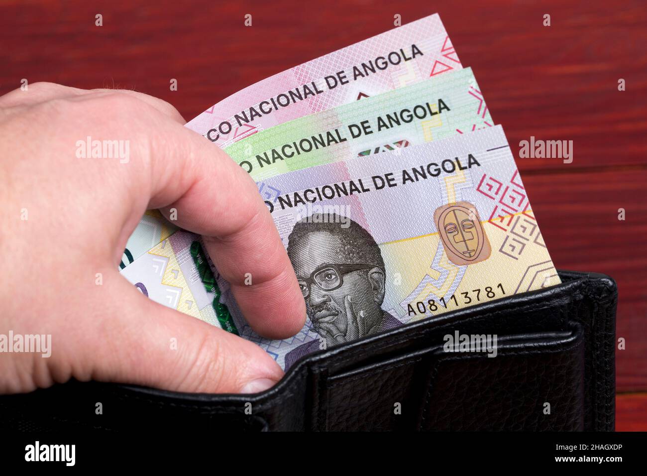Angolan money - Kwanza in the black wallet Stock Photo - Alamy