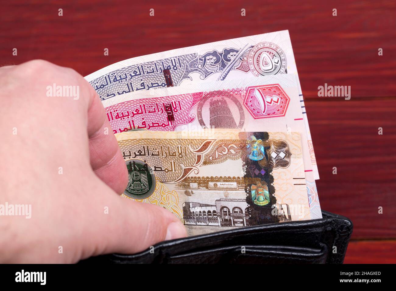 United Arab Emirates money - dirham in the black wallet Stock Photo - Alamy