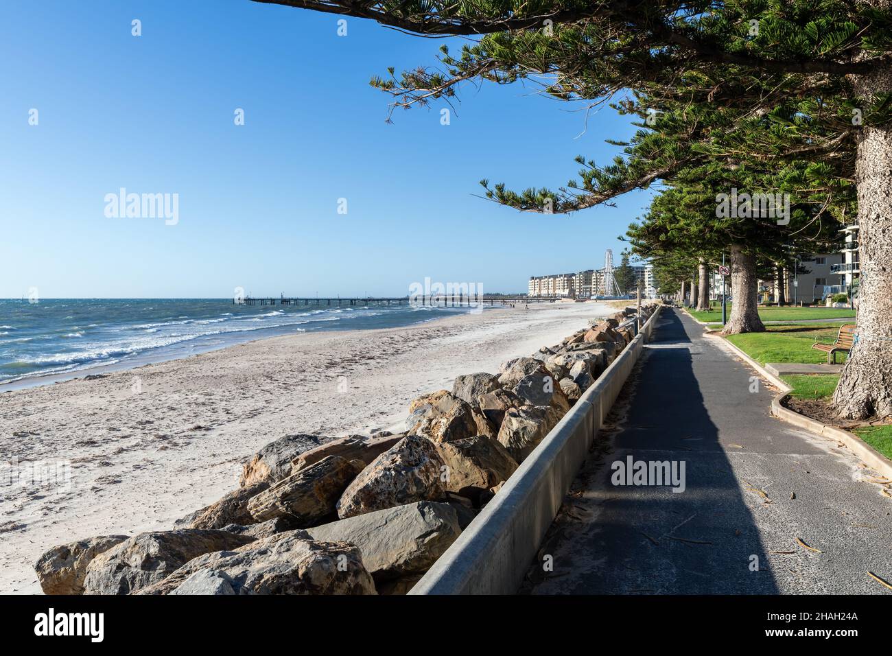 Iconic Glenelg Beach Esplanade on a bright summer day. The jetty can be ...