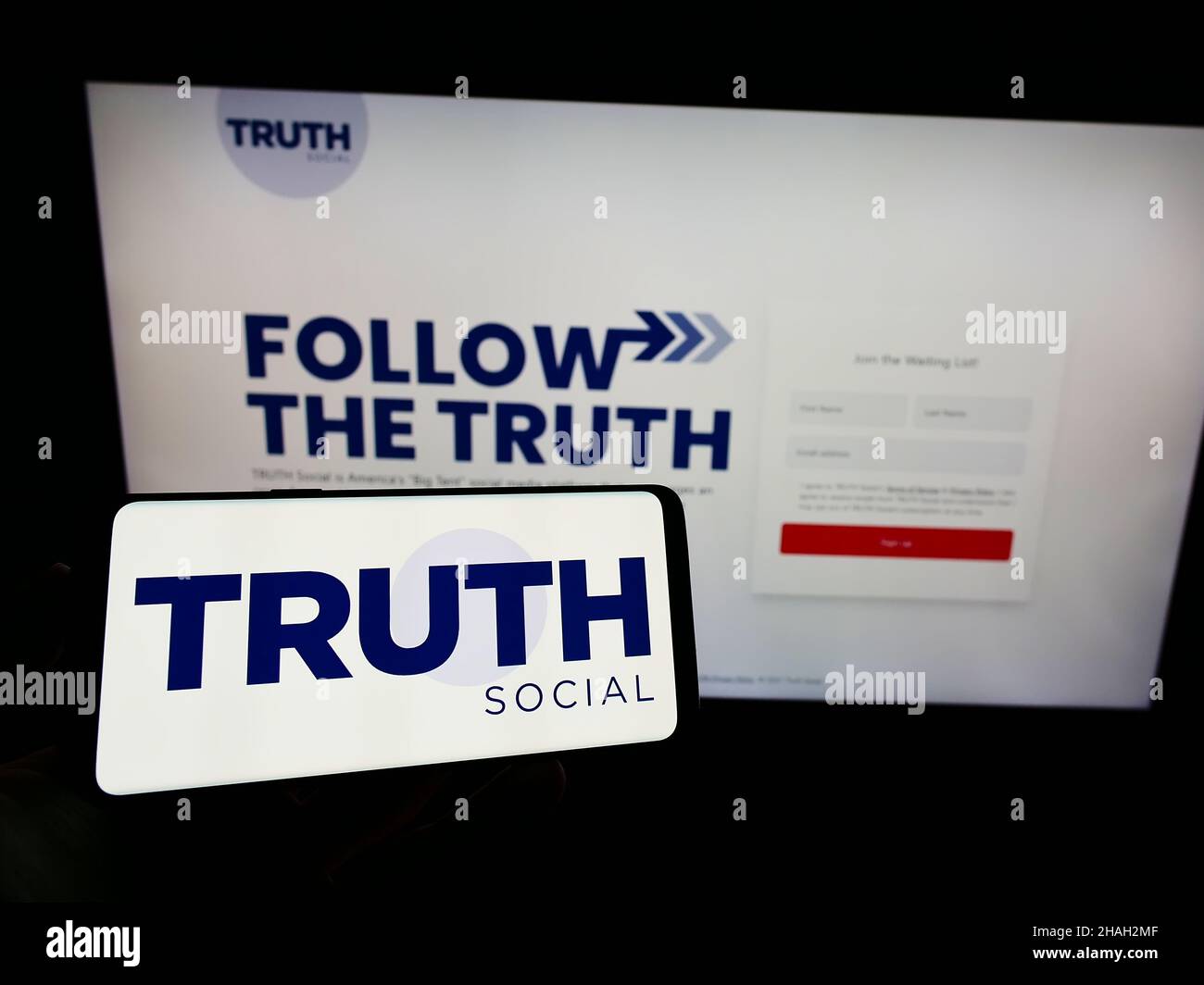 Person holding cellphone with logo of US media platform TRUTH Social ...