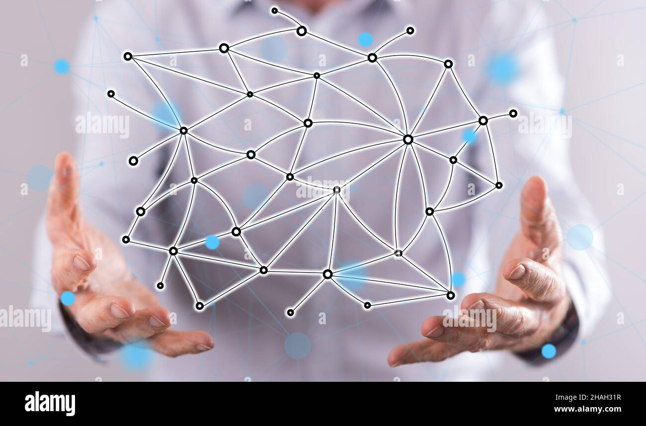 Virtual network concept above the hands of a man in background Stock ...