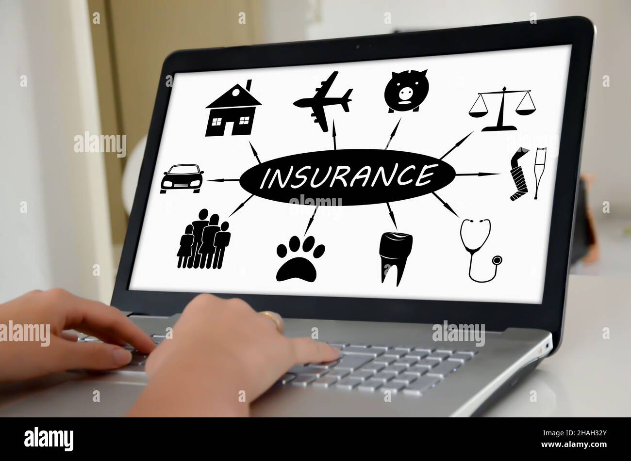 Hands on a laptop with screen showing insurance concept Stock Photo - Alamy