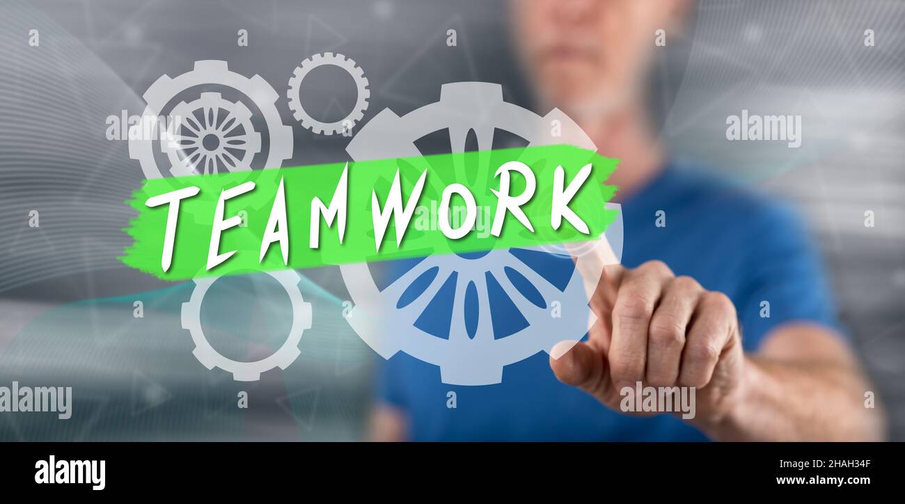 Man touching a teamwork concept on a touch screen with his finger Stock ...