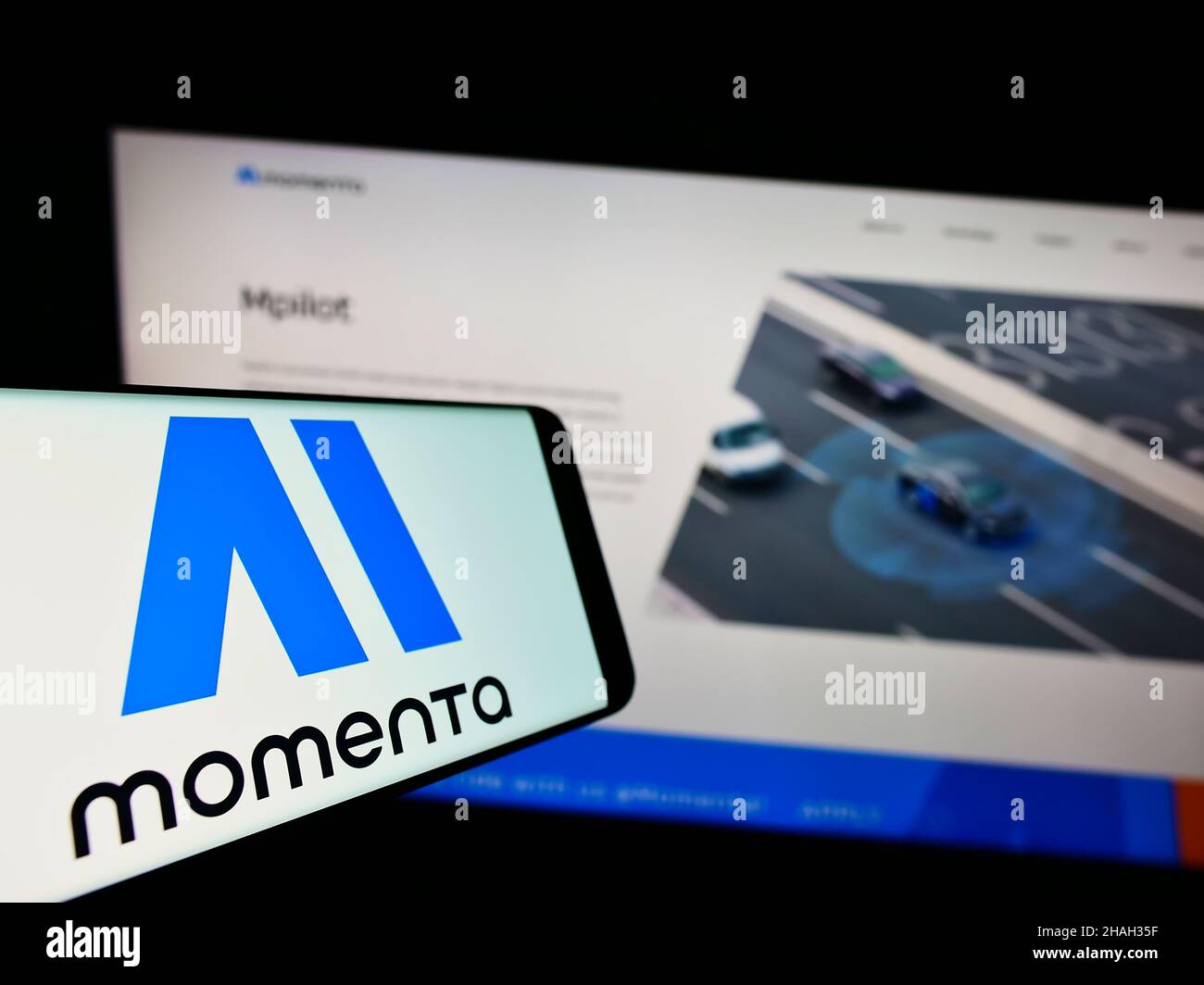 Smartphone with logo of Chinese autonomous driving company Momenta ...