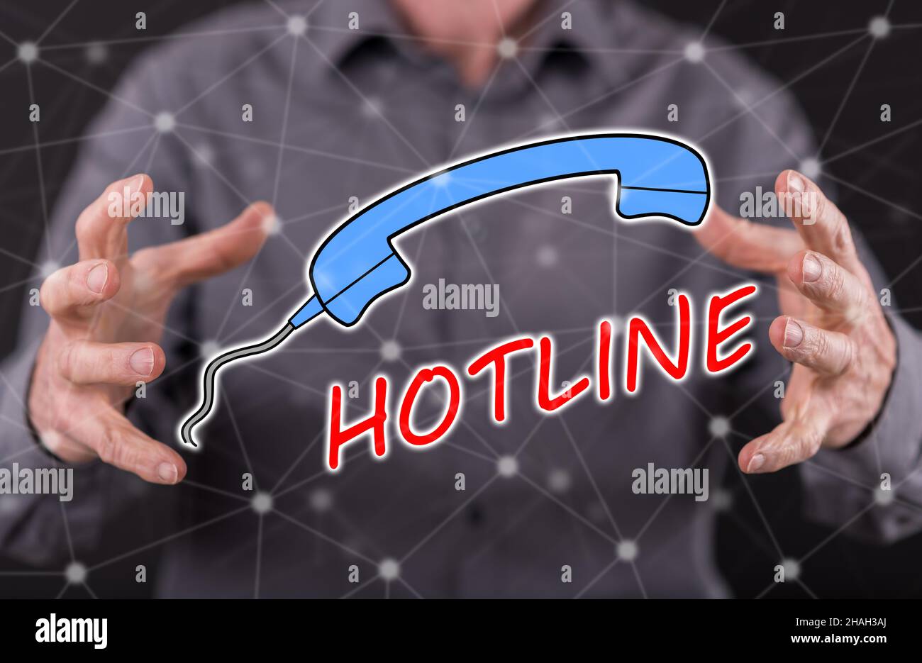 Hotline concept between hands of a man in background Stock Photo - Alamy