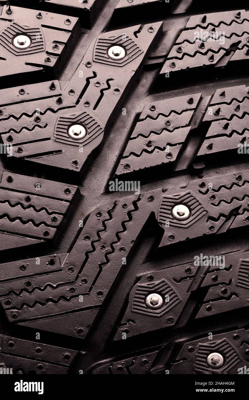 winter studded tire tread close-up. safe winter tires pattern ...