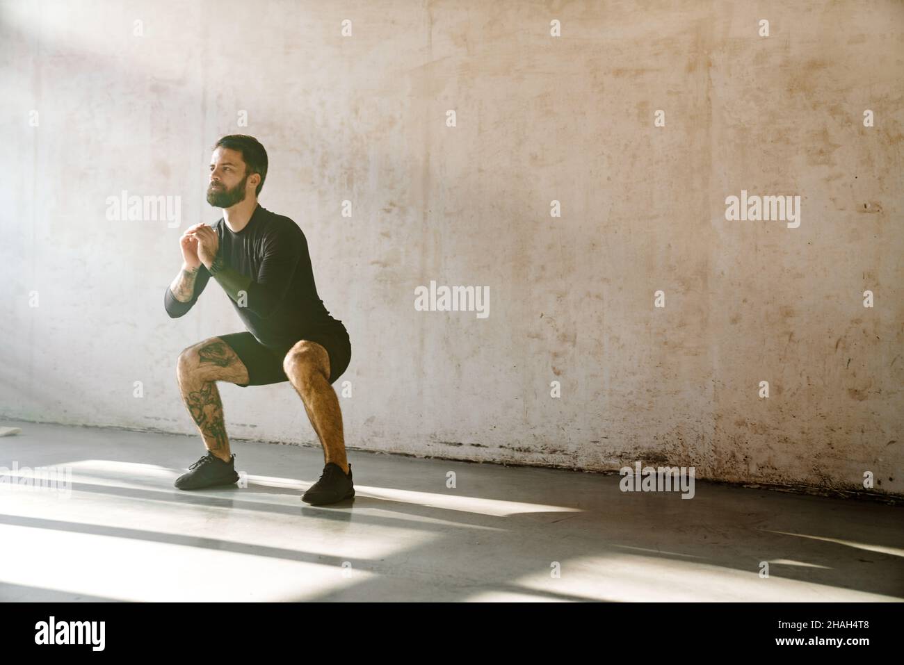 Squat exercise wall hi-res stock photography and images - Alamy