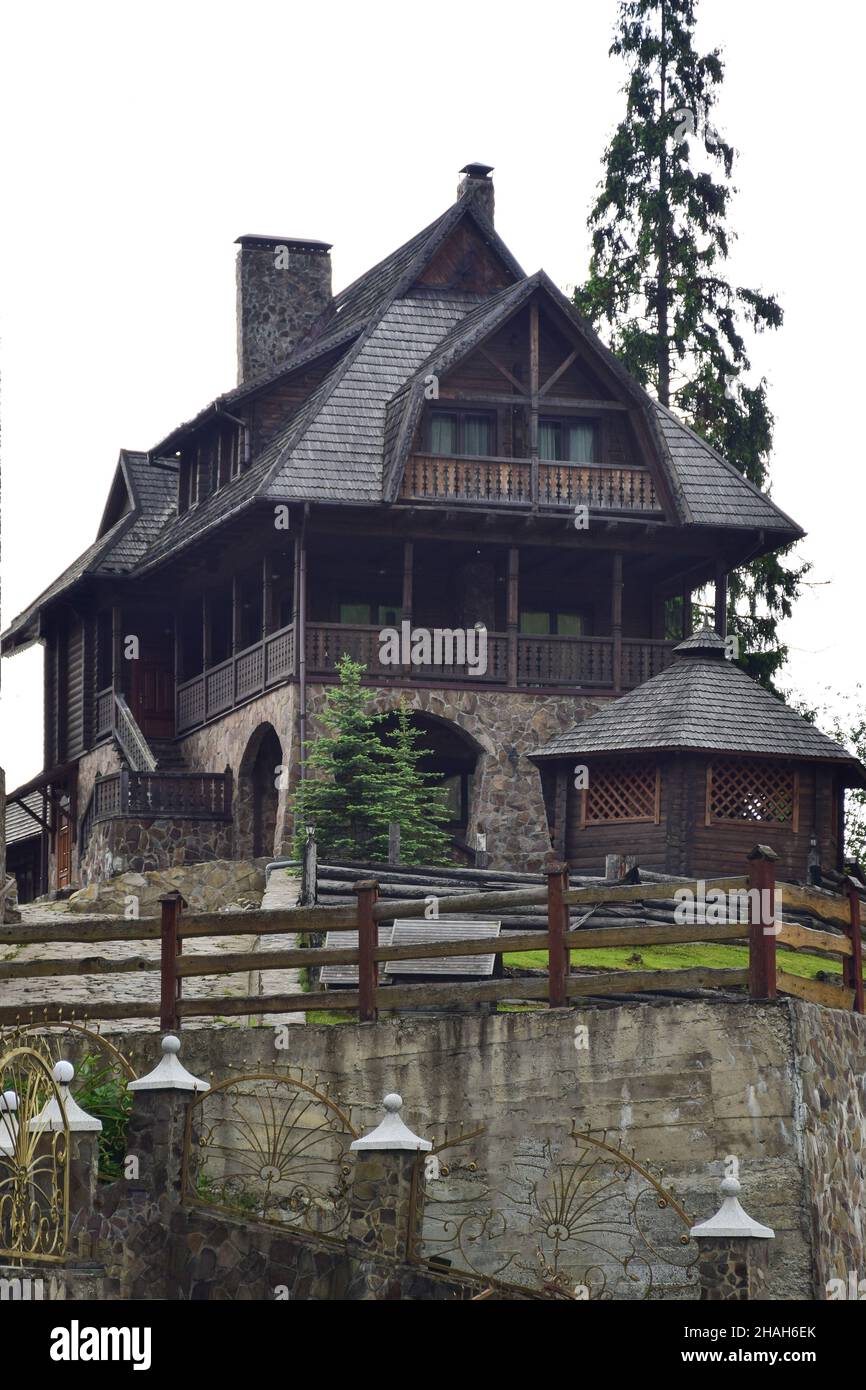 A very old two-story hotel building or just a dwelling on a stone hill ...