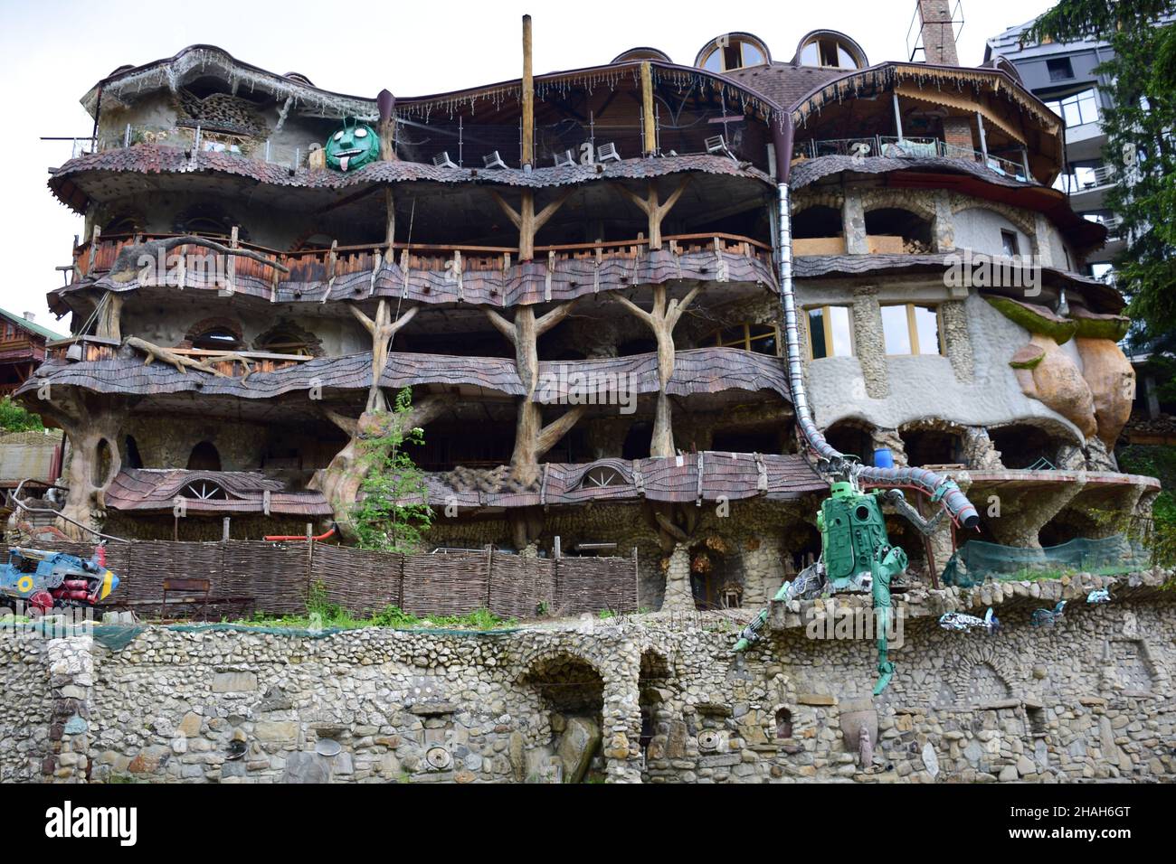 A very old two-story hotel building or just a dwelling on a stone hill ...