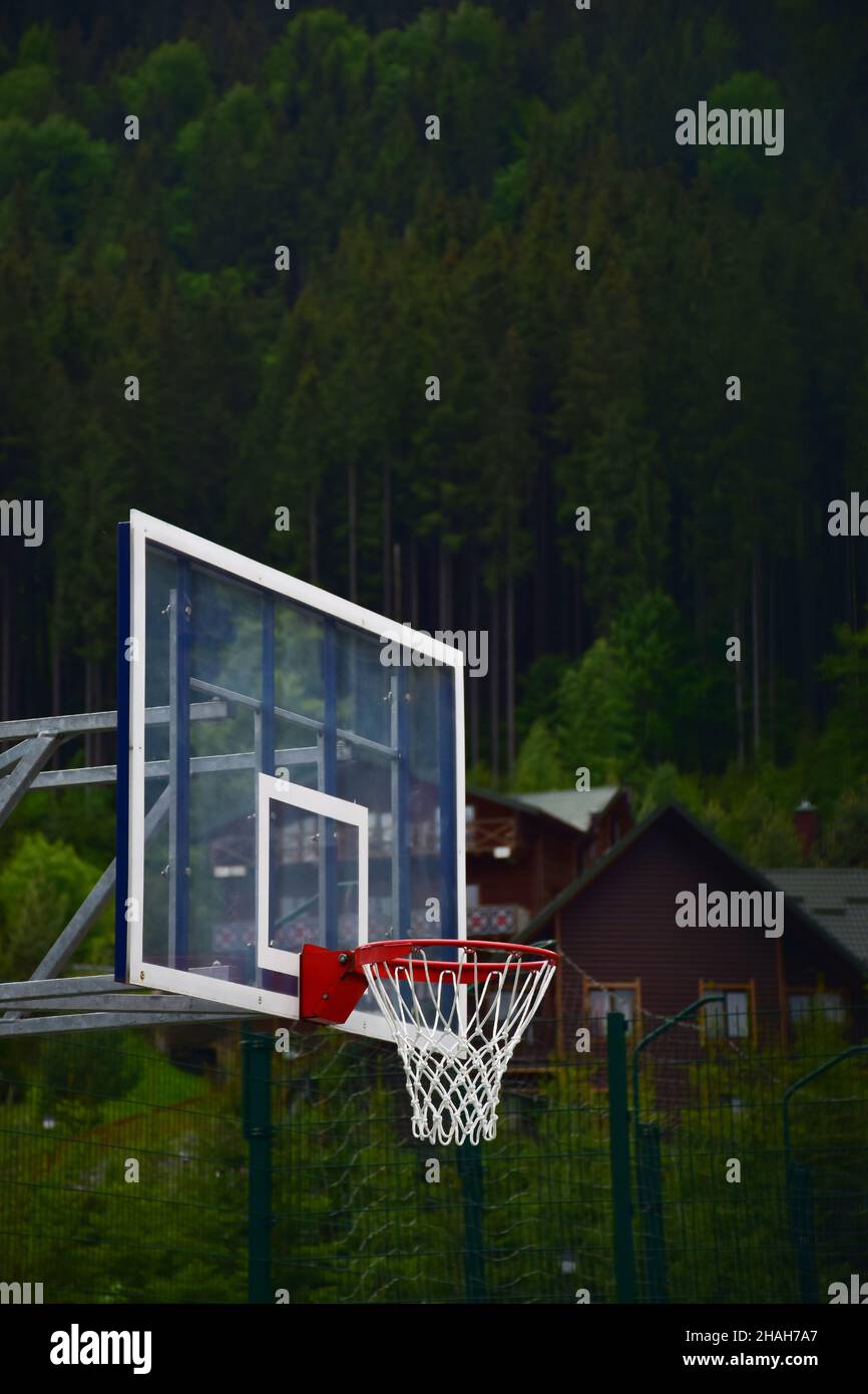 Basketball backboard and hoop with a net on a blurred background of ...